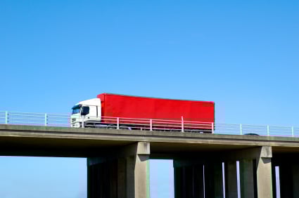 Container Delivery Basics: Tilt-Bed, Flat-Bed, or Chassis